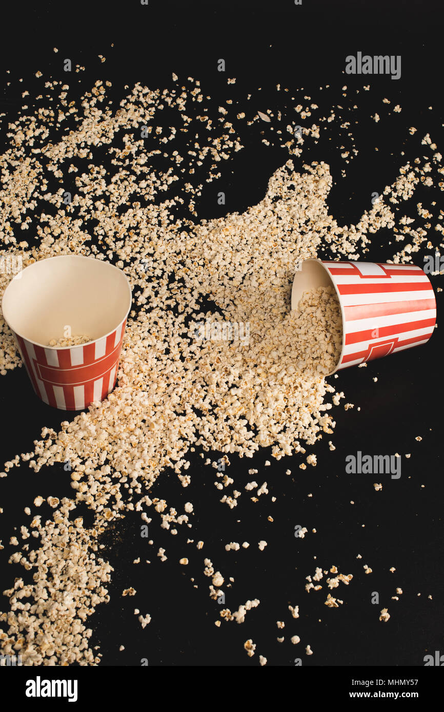 popcorn spilled of cardboard buckets Stock Photo - Alamy