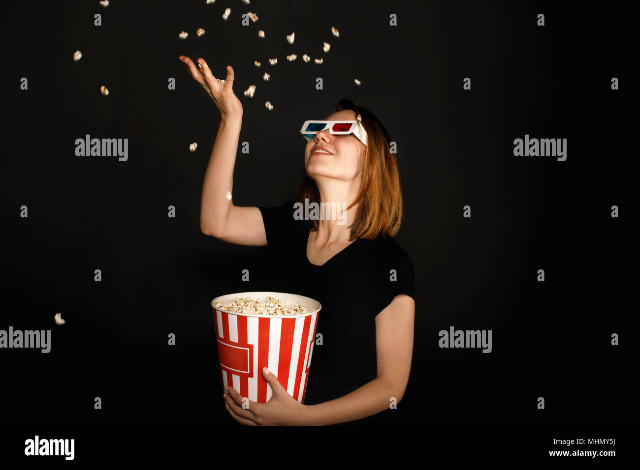 woman throwing up popcorn Stock Photo - Alamy