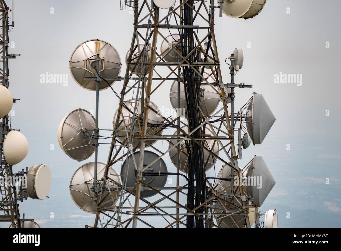 Communication Antenna on the light blue sky background Stock Photo - Alamy