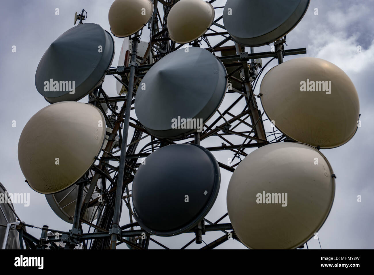 Communication Antenna on the light blue sky background Stock Photo - Alamy