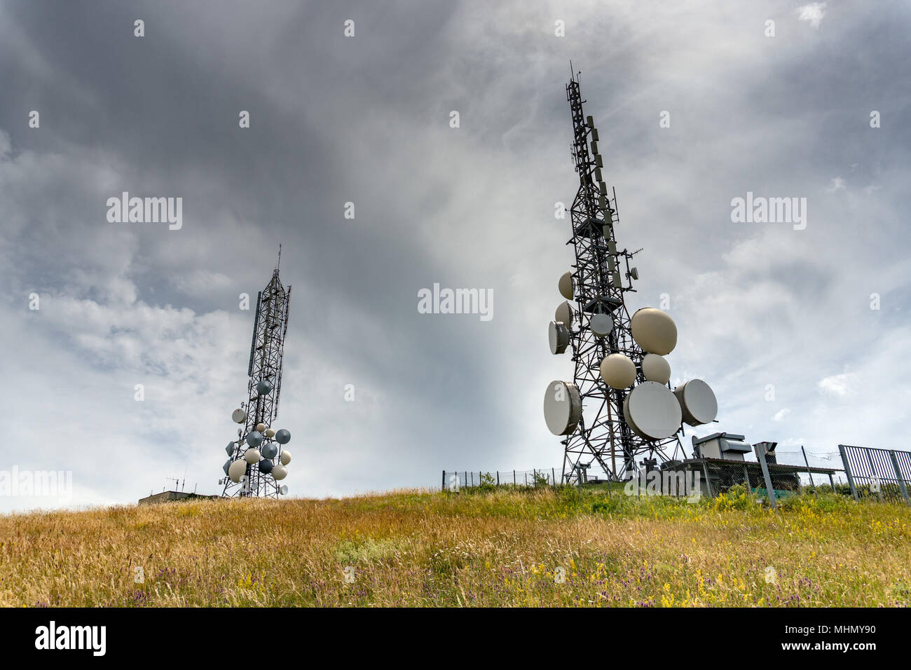 Communication Antenna on the light blue sky background Stock Photo - Alamy
