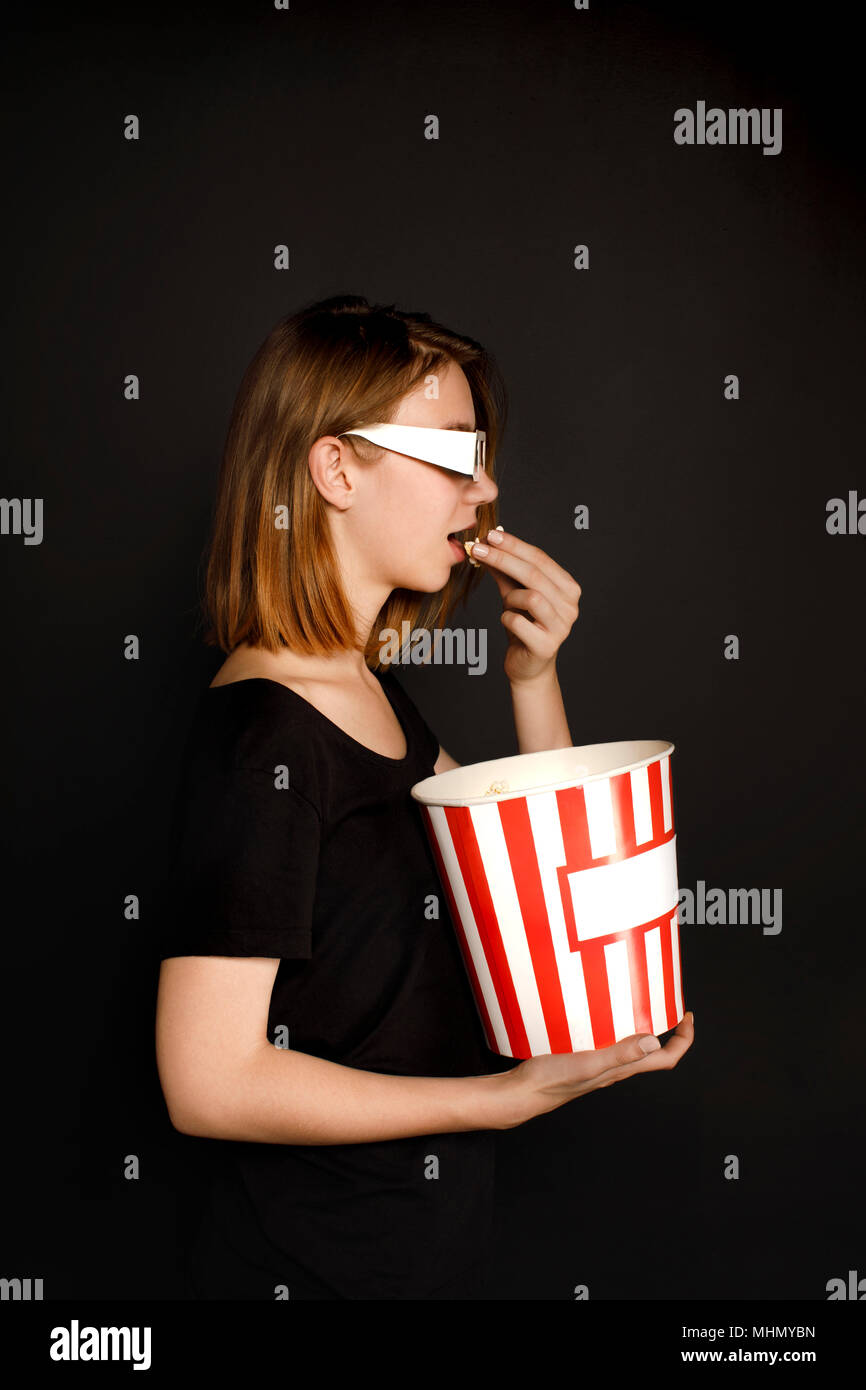 woman in 3d glasses eating popcorn Stock Photo - Alamy