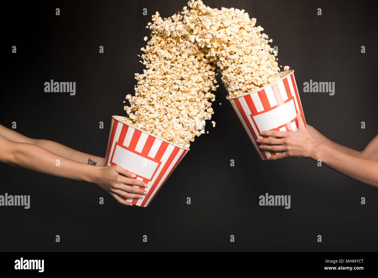 people with buckets of popcorn Stock Photo - Alamy