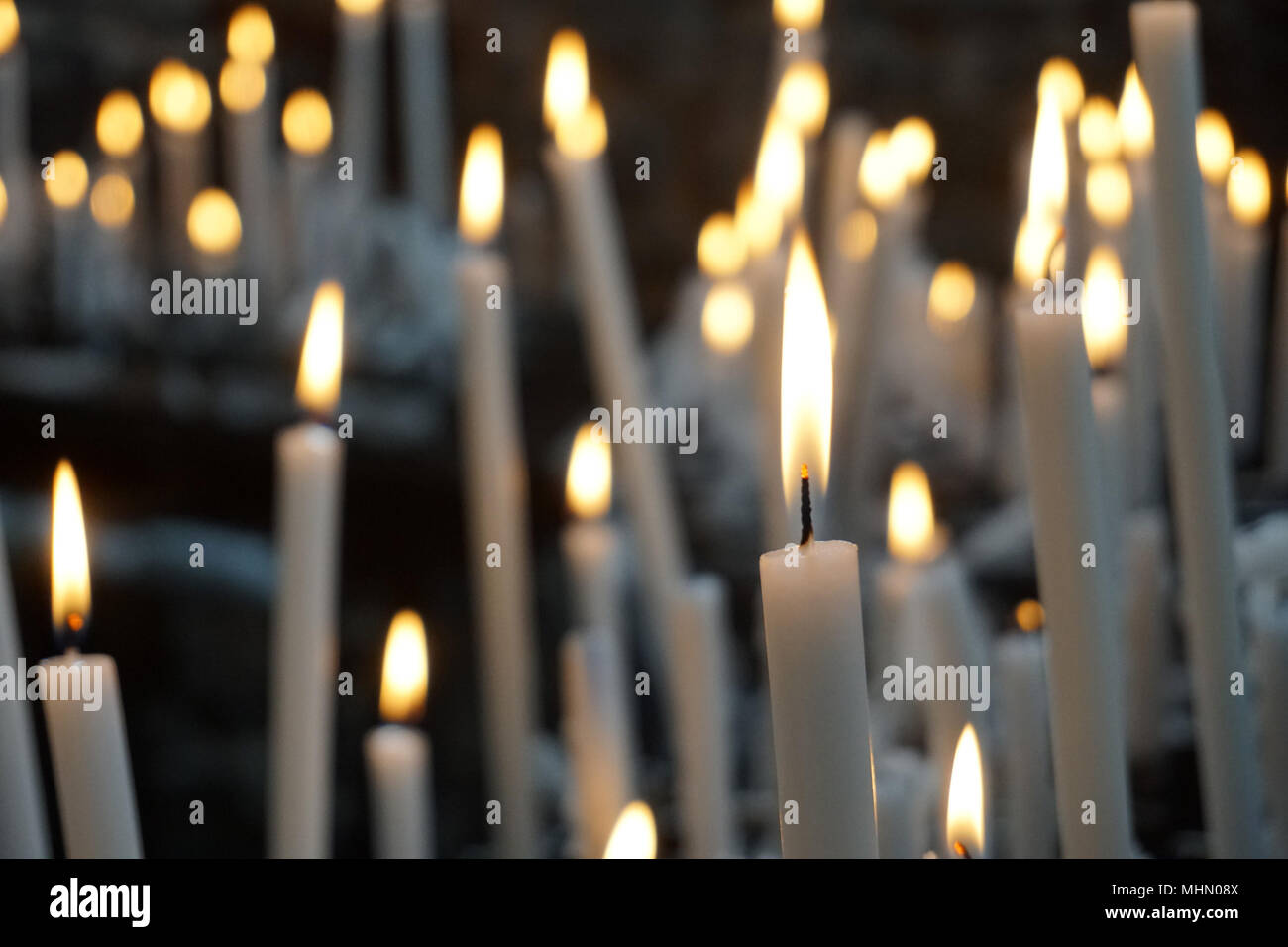 church candles weaving flames inside old medieval church Stock Photo ...
