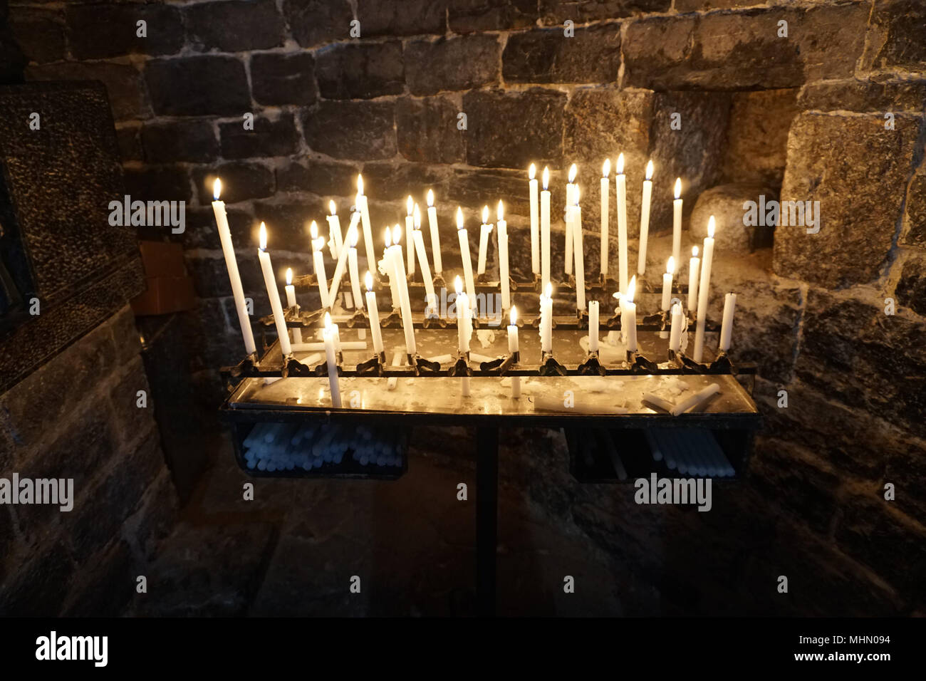 church candles weaving flames inside old medieval church Stock Photo ...