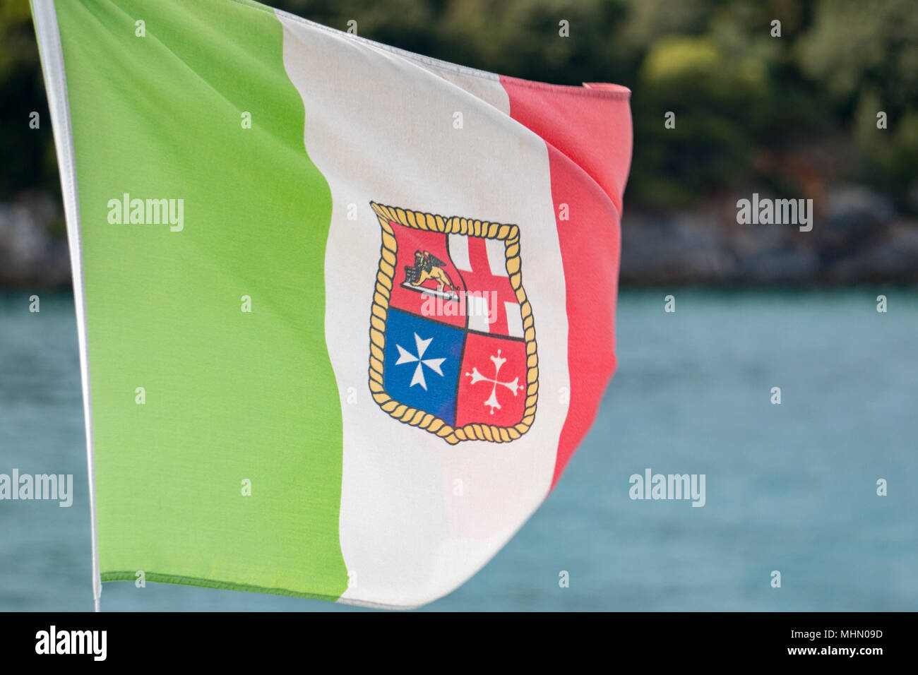italian marine flag waving on the mediterranean sea background Stock ...