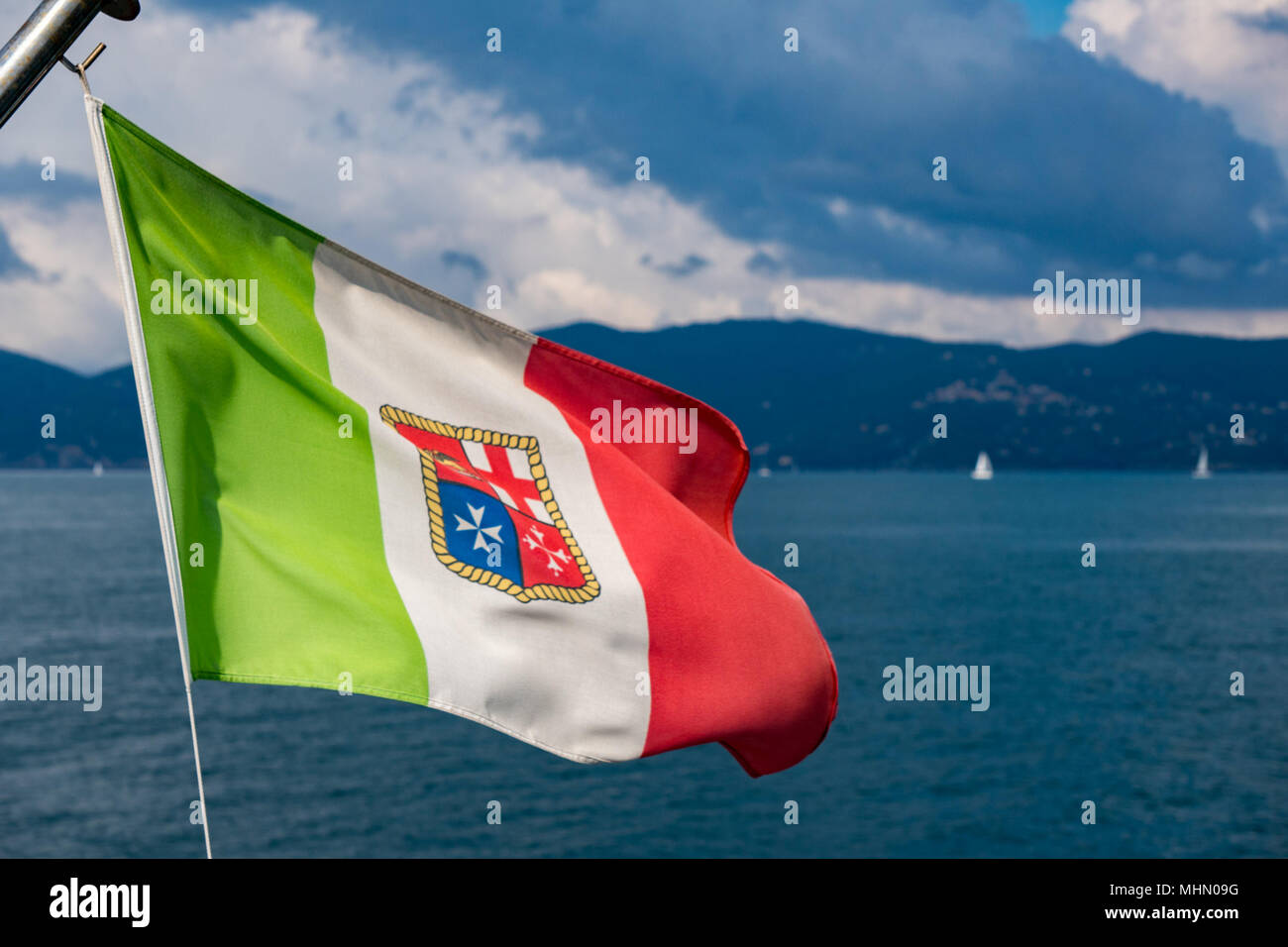 italian marine flag waving on the mediterranean sea background Stock ...