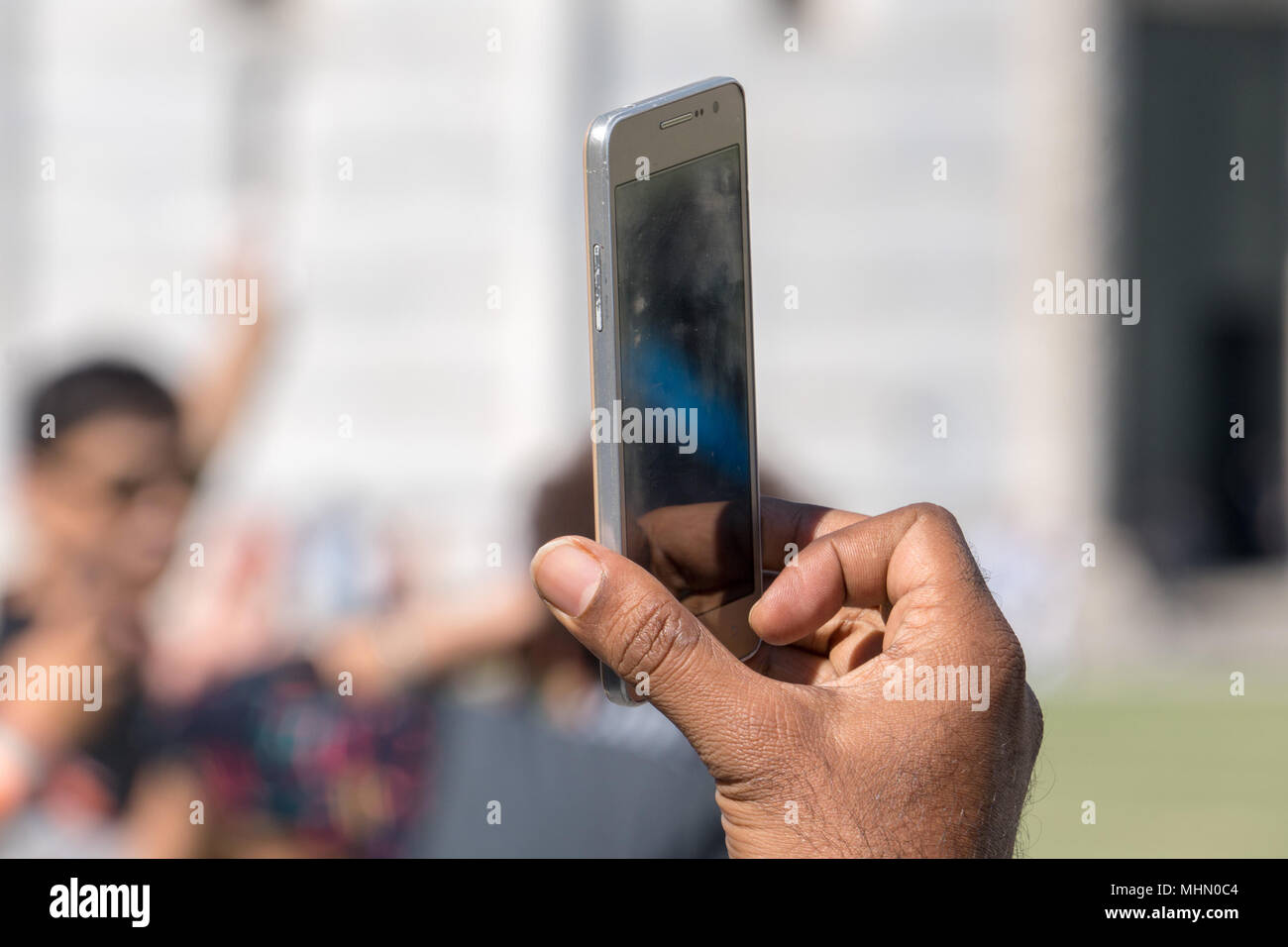 hand taking picture with smartphone on soft color background Stock ...