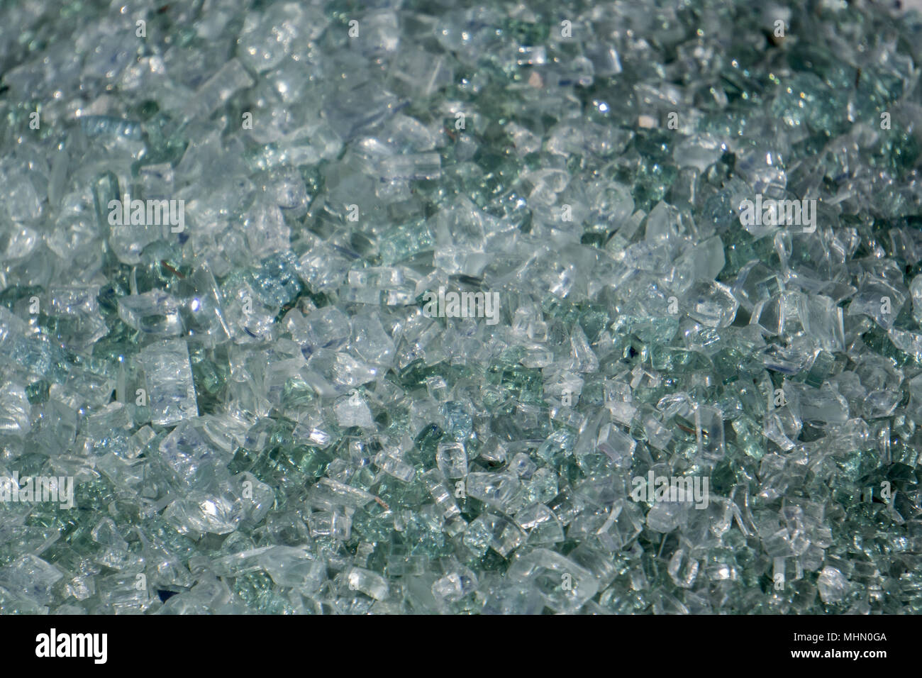 Broken glass many color pieces detail Stock Photo - Alamy