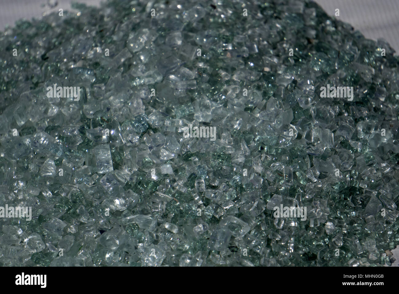 Broken glass many color pieces detail Stock Photo - Alamy