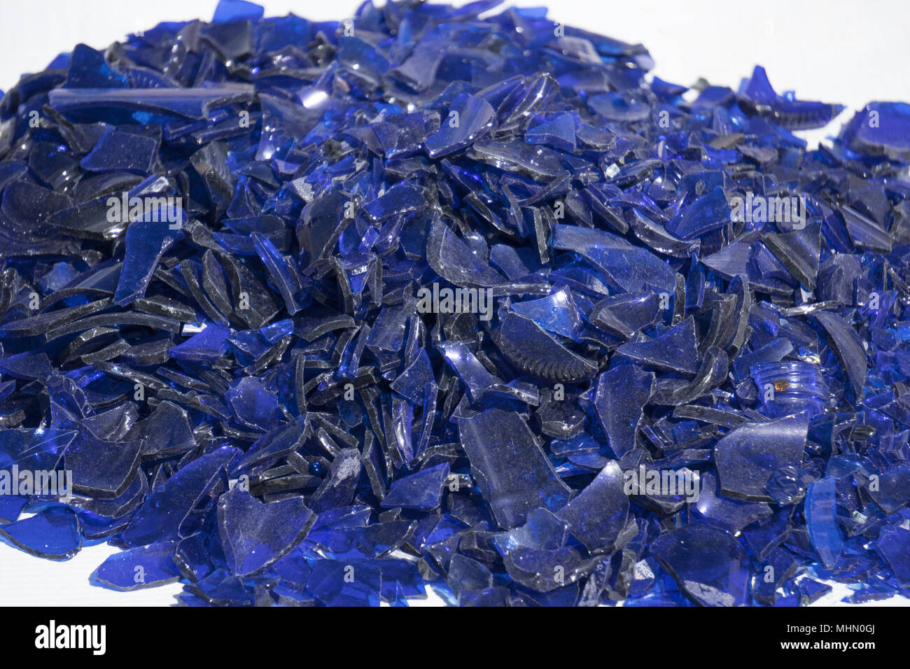 Broken glass many color pieces detail Stock Photo - Alamy
