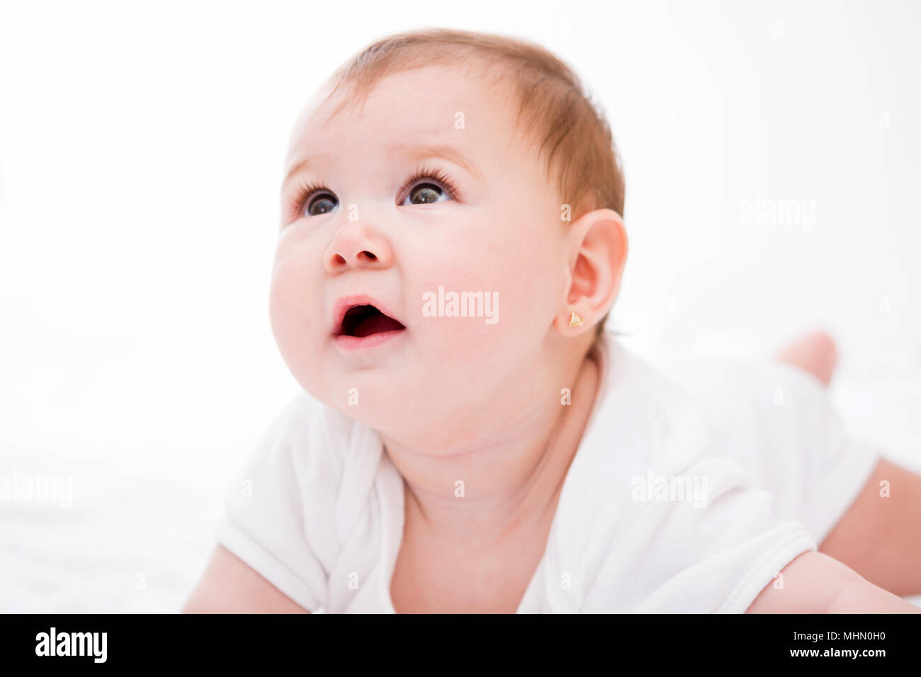 Adorable little baby girl on white background Stock Photo - Alamy