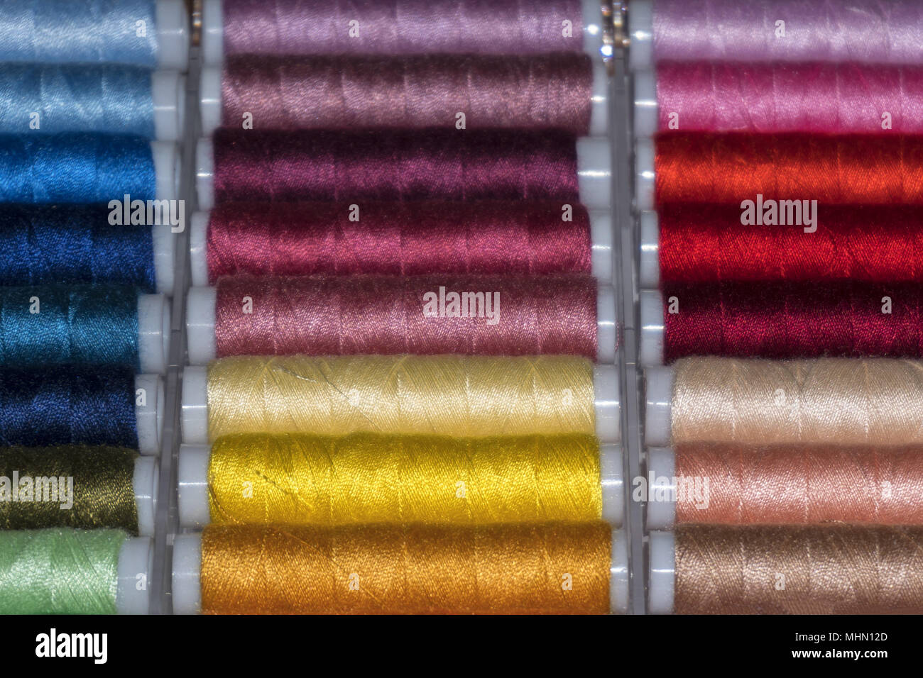 Many different colorful threads hi-res stock photography and images - Alamy