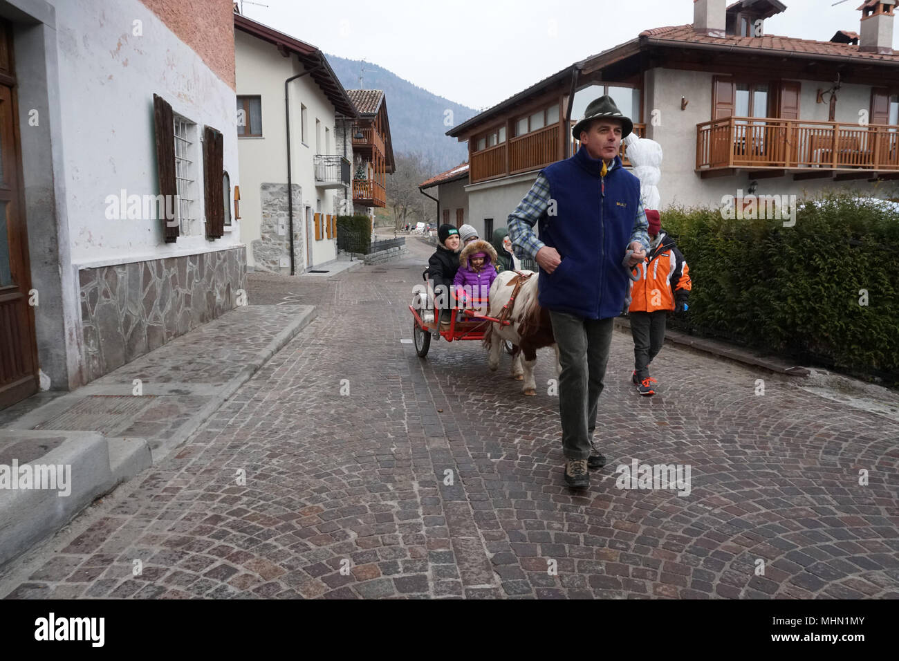 RANGO, ITALY - DECEMBER 1, 2017 - People buying at the shops of ...