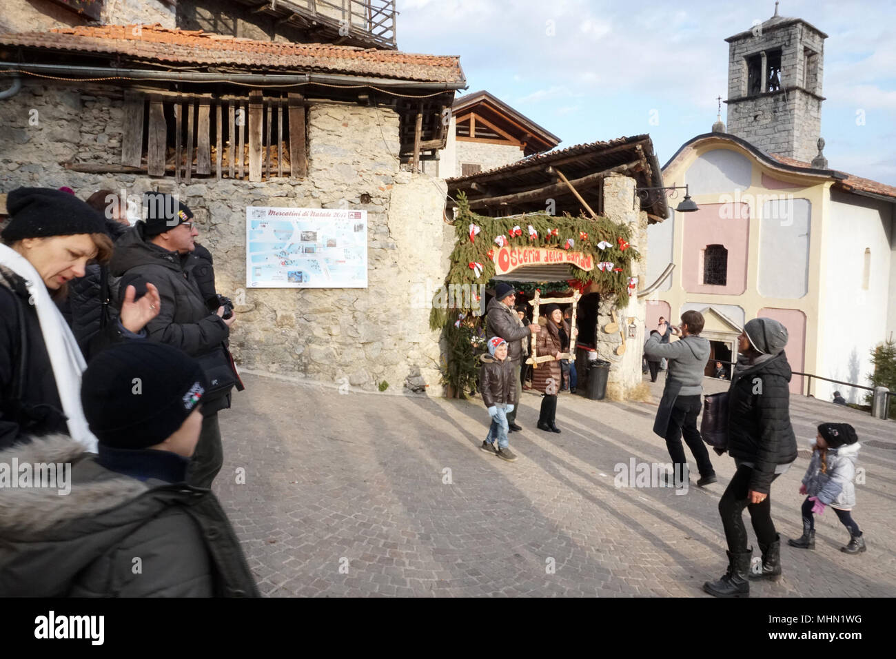 RANGO, ITALY - DECEMBER 1, 2017 - People buying at the shops of ...
