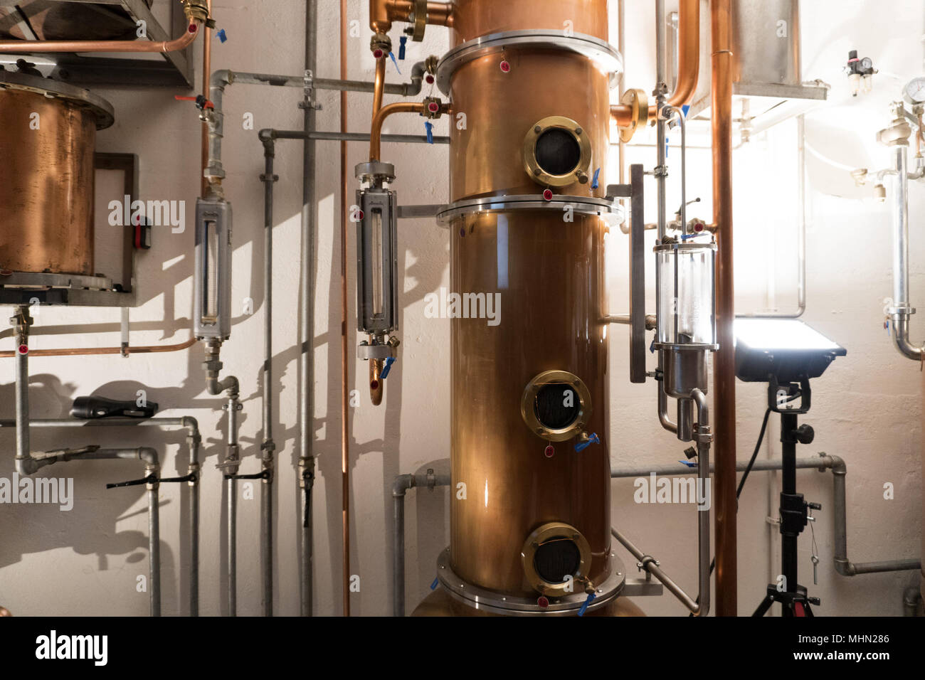 Copper still alembic inside distillery to distill grapes and produce ...