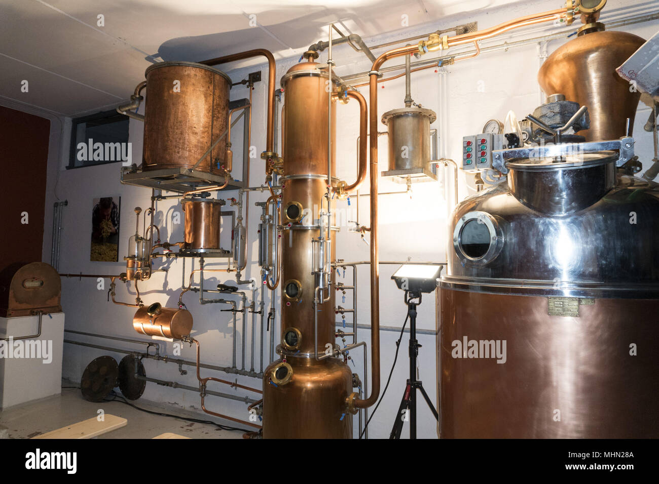 Copper still alembic inside distillery to distill grapes and produce ...