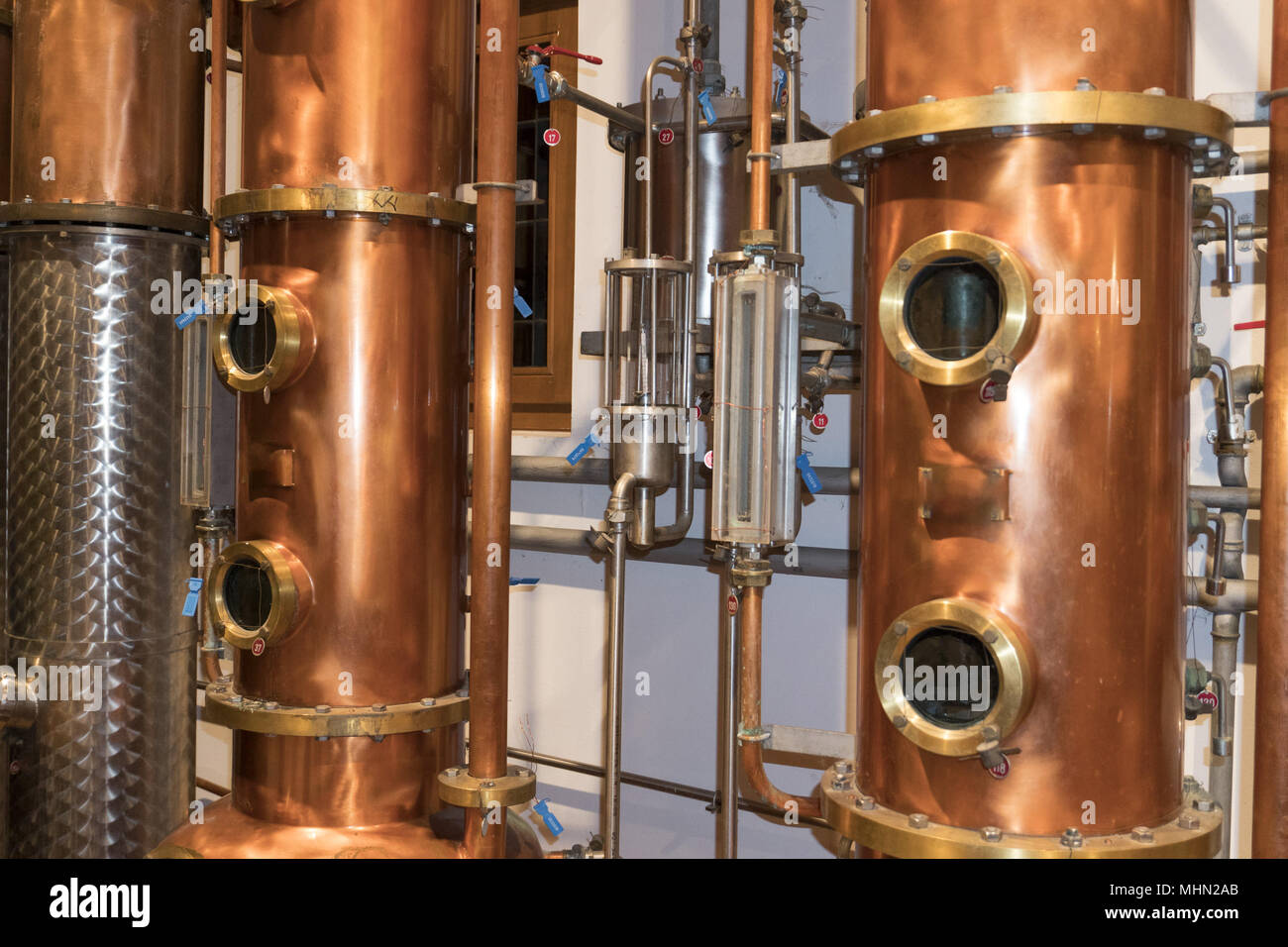 Copper still alembic inside distillery to distill grapes and produce ...