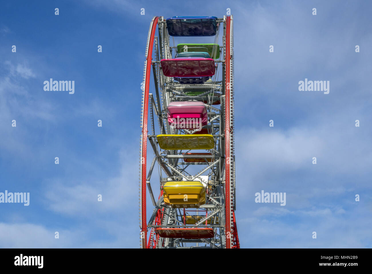 amusement park panoramic wheel on blue sky background Stock Photo - Alamy