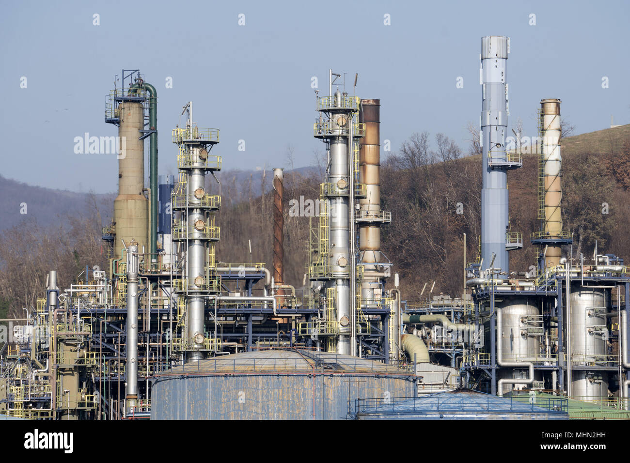 oil refinery on blue sky cloudy background Stock Photo - Alamy