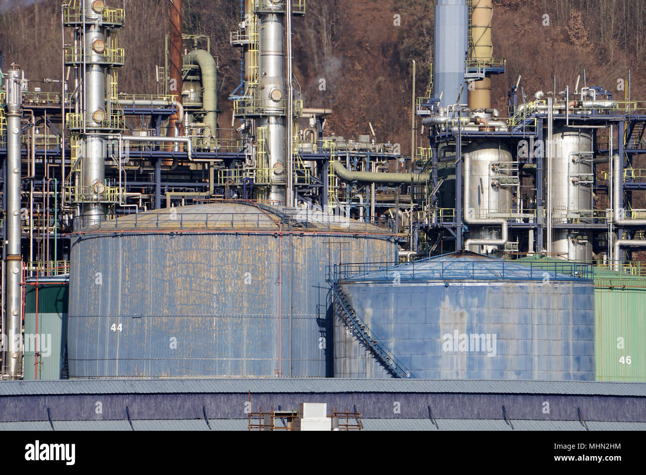 oil refinery on blue sky cloudy background Stock Photo - Alamy