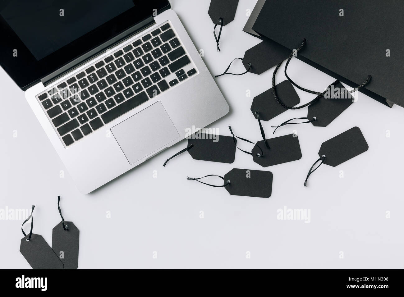 laptop and black price tags Stock Photo - Alamy
