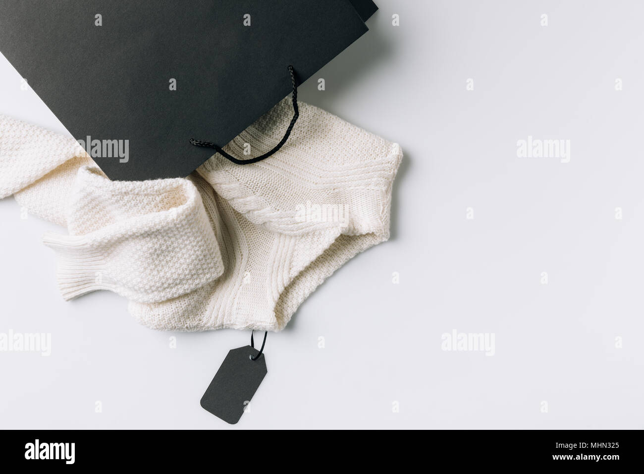 paper bag with sweater inside Stock Photo - Alamy