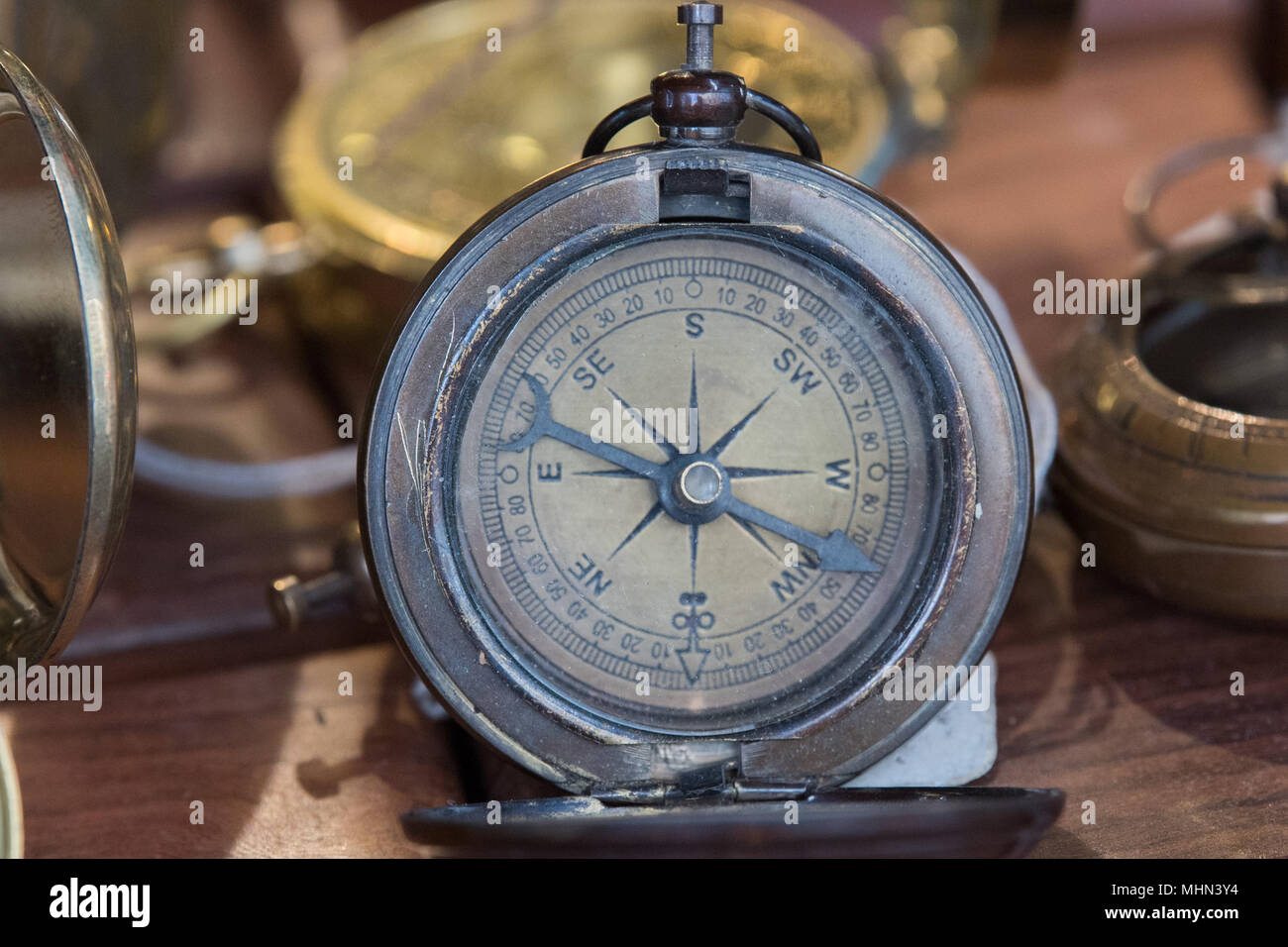 old antique pocket compass close up Stock Photo - Alamy