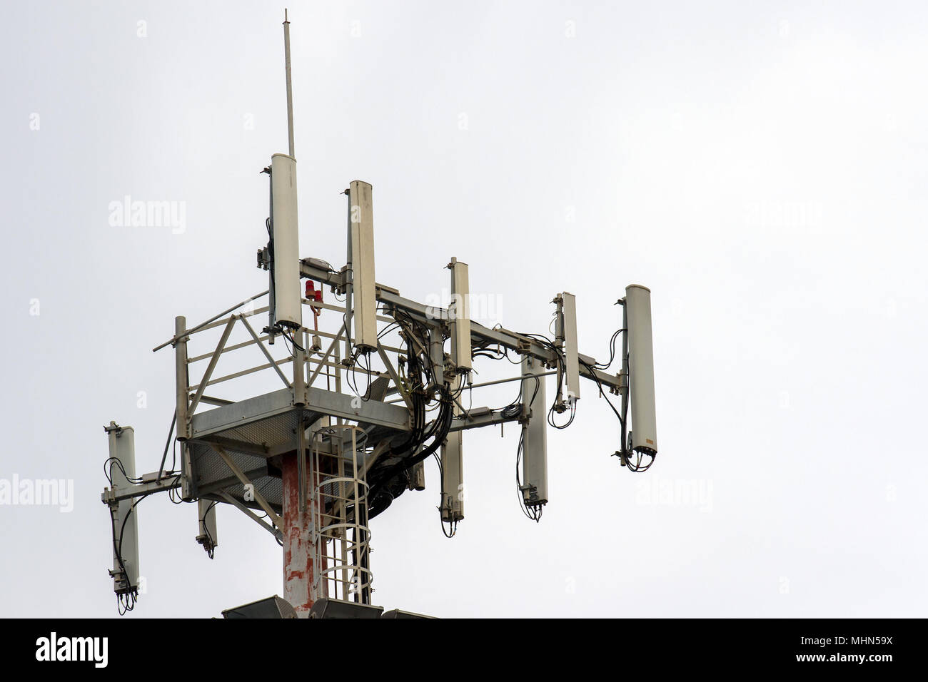 cellular Communication Antenna on the white sky background Stock Photo ...