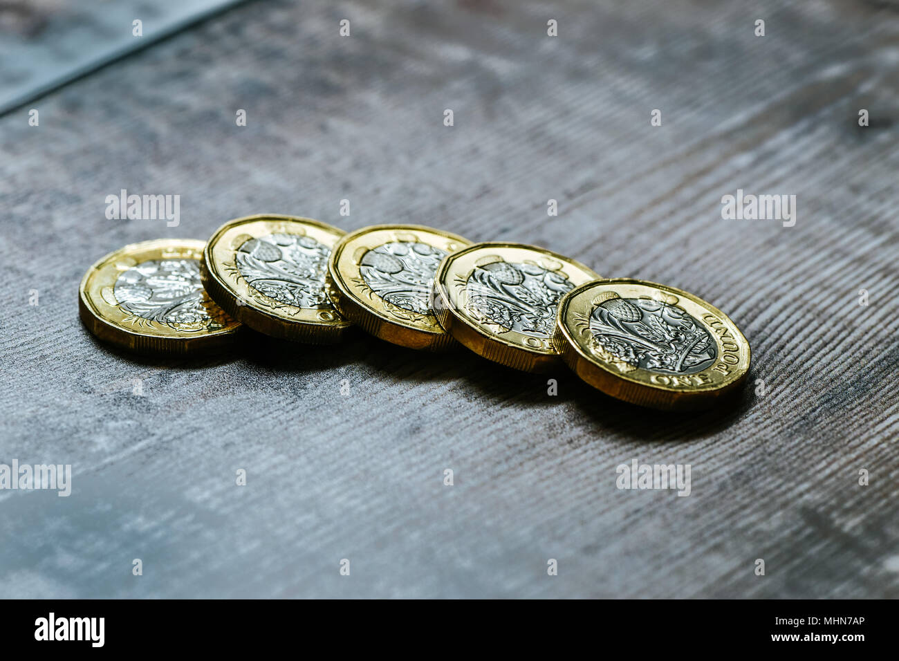 New pound coins currency lined up in pattern. Finance and business ...