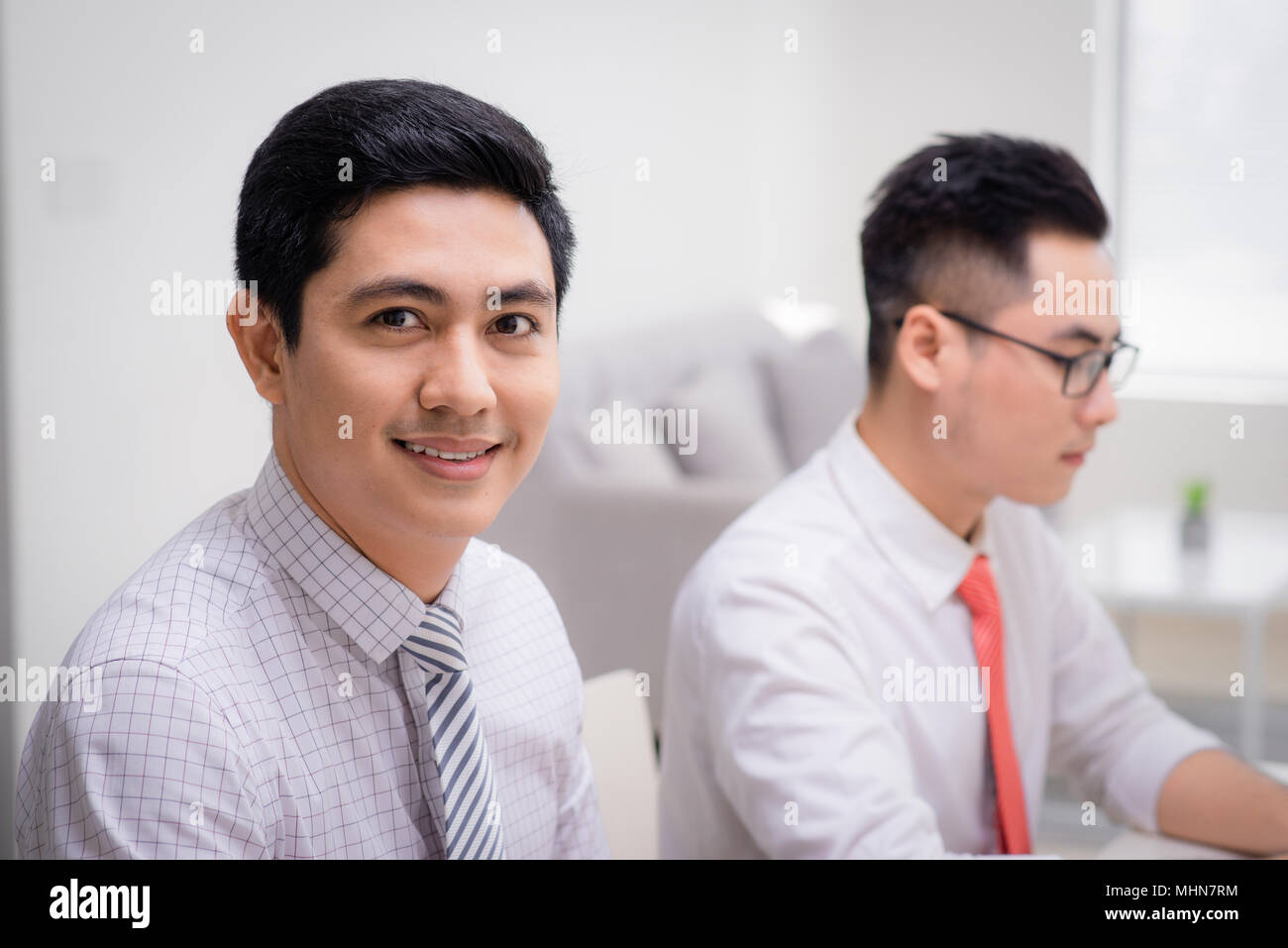 Two employees working in the office hi-res stock photography and images ...