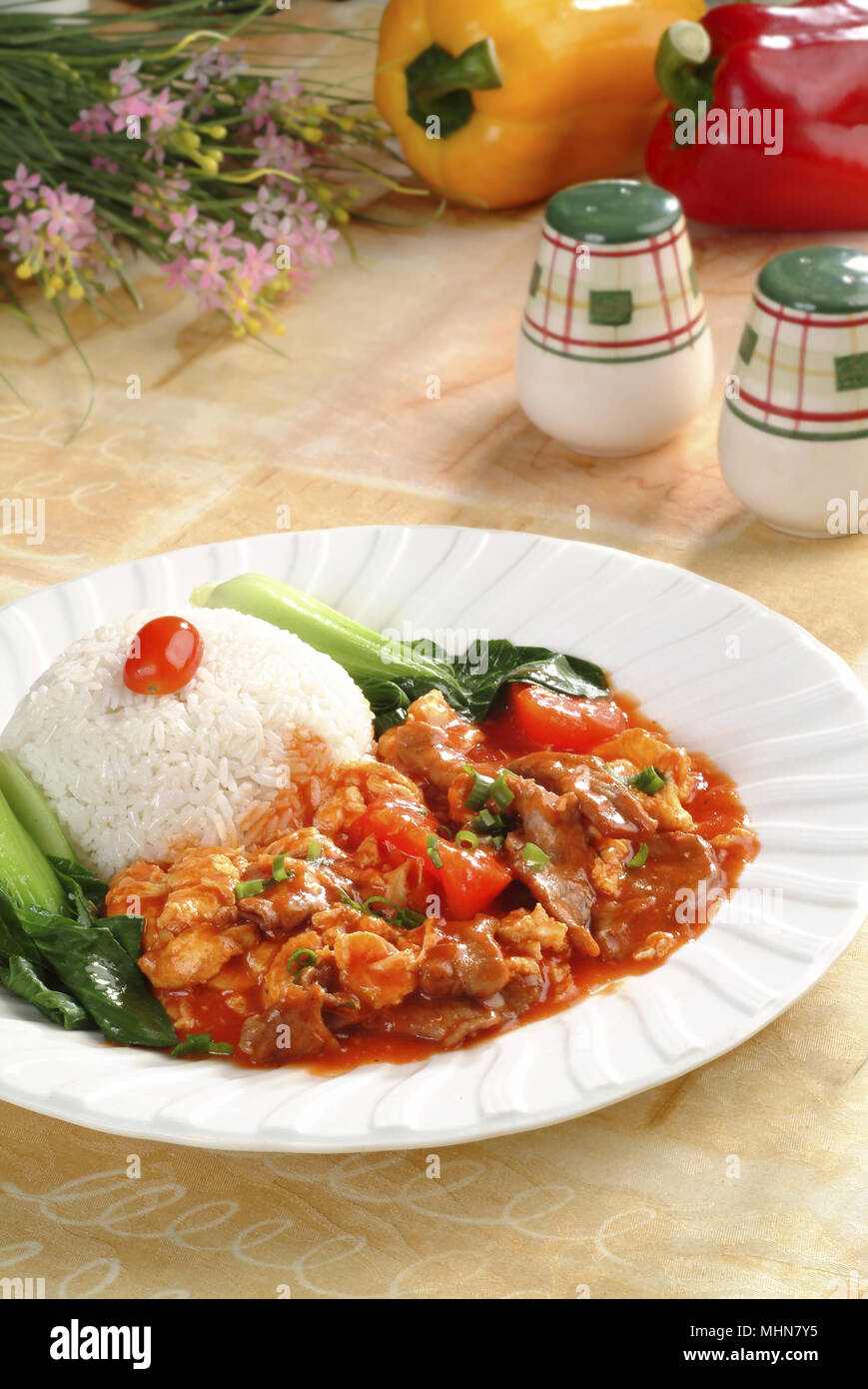 tomato beef over rice Stock Photo - Alamy