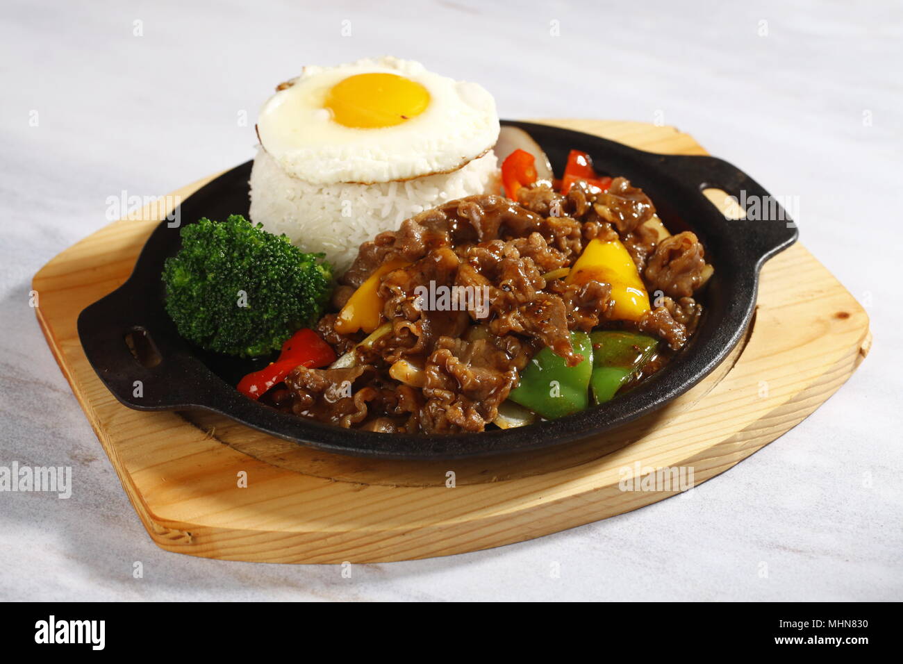 stir fried beef over rice Stock Photo - Alamy