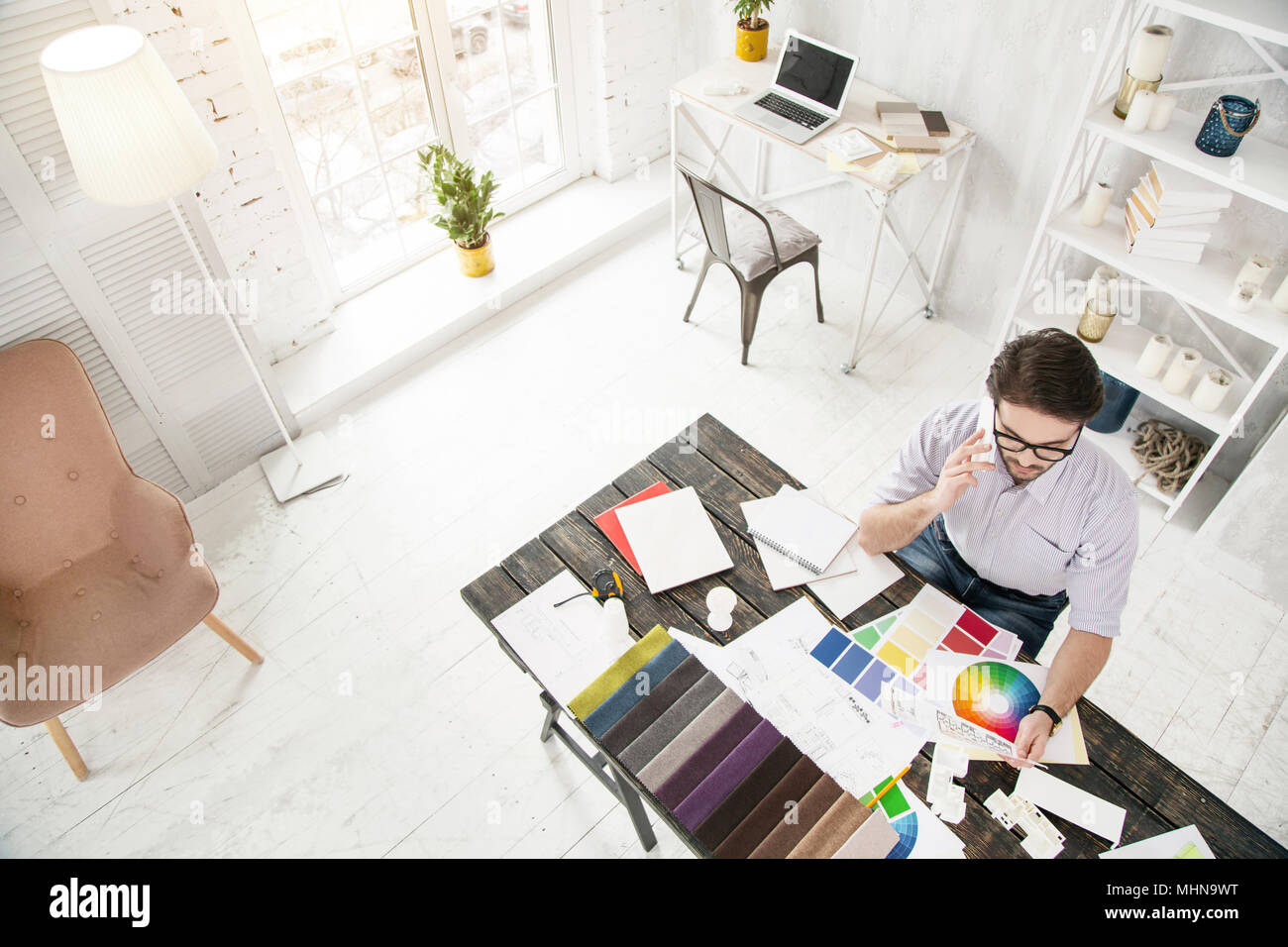 Determined manager talking on the phone Stock Photo - Alamy