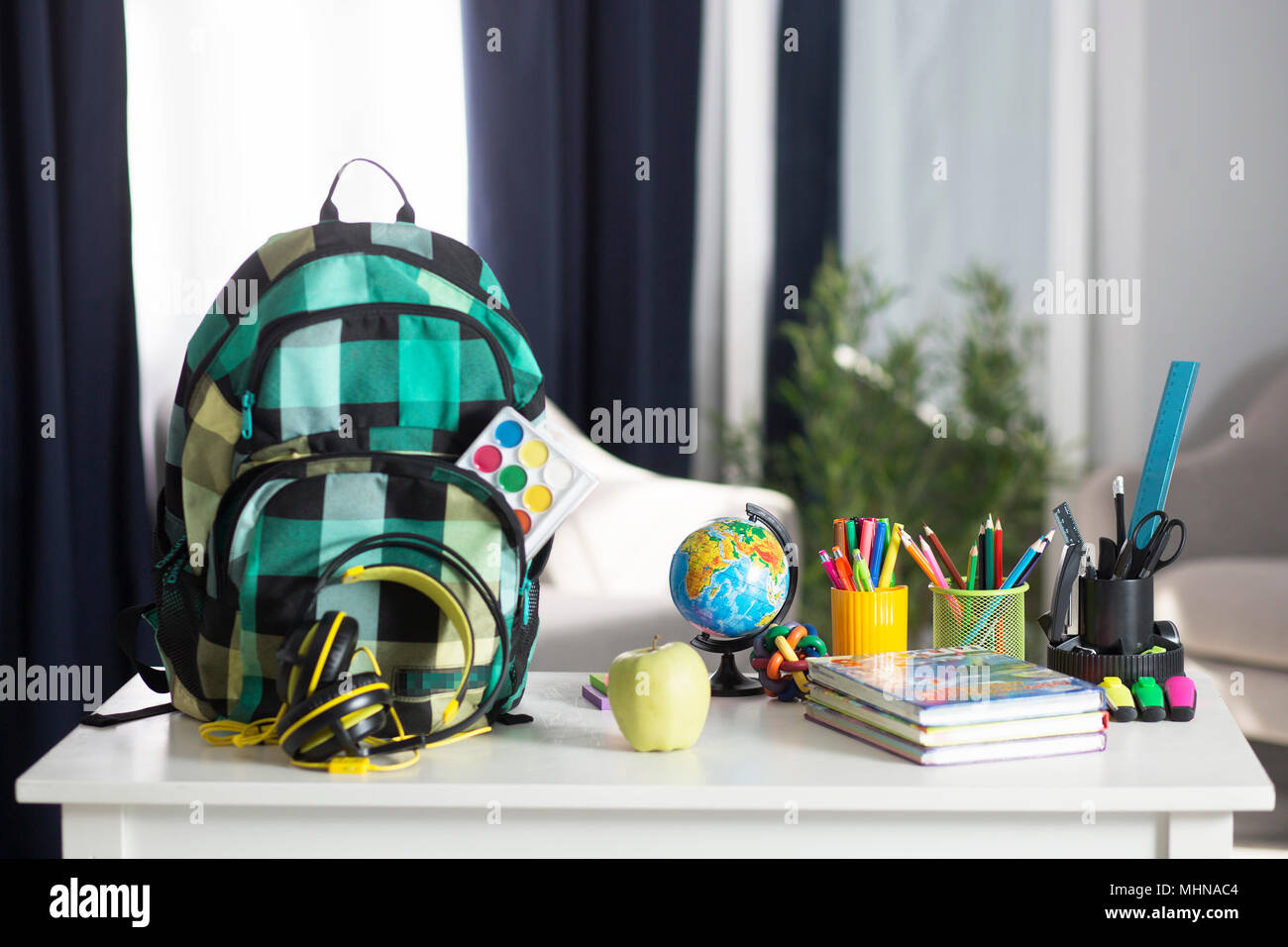 The school backpack is on the table. School supplies Stock Photo - Alamy