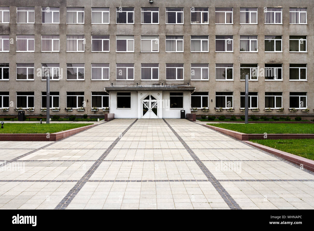 Old gray office building wall with a lot of windows and door Stock ...