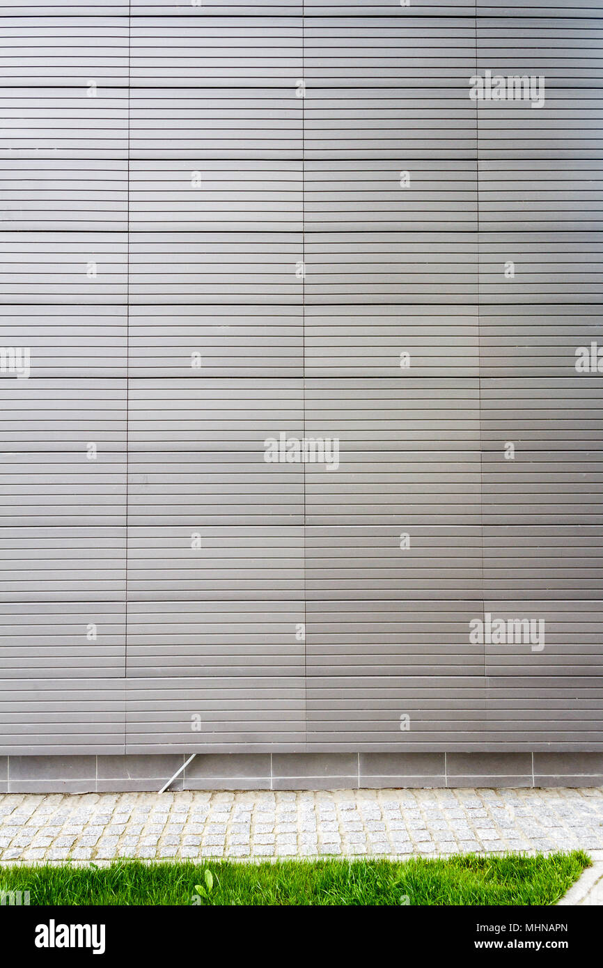 Modern tile wall and green grass. Architecture detail background Stock ...