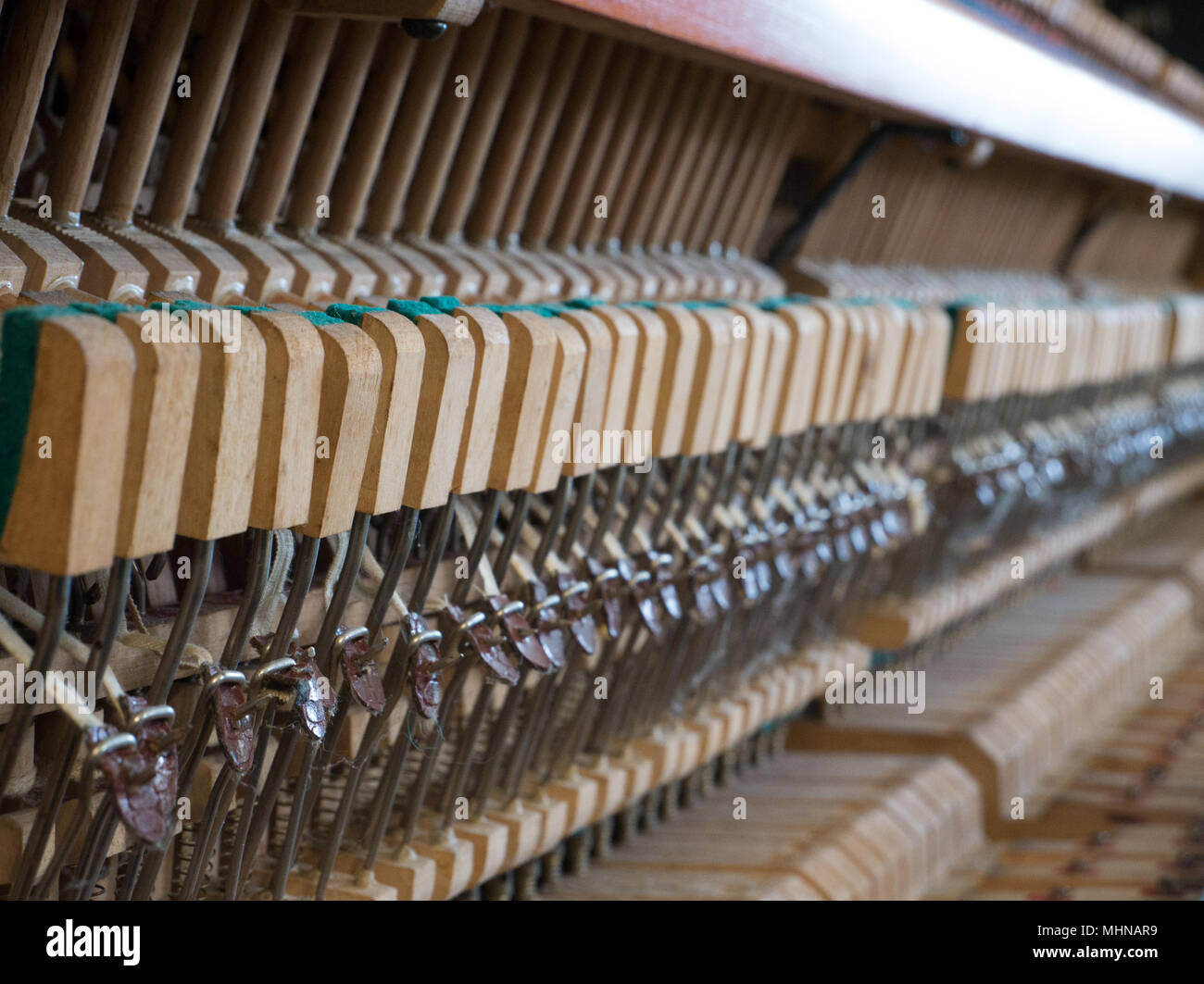 Close up image of interior of grand piano showing strings and structure ...