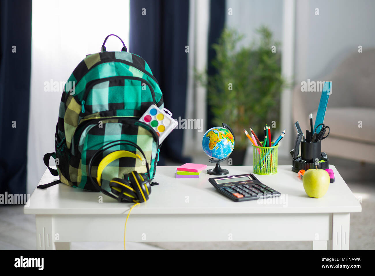 The school backpack is on the table. School supplies Stock Photo - Alamy