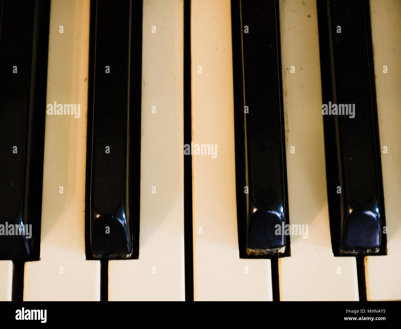 Piano keyboard, see black and white keys, the wooden old structure ...