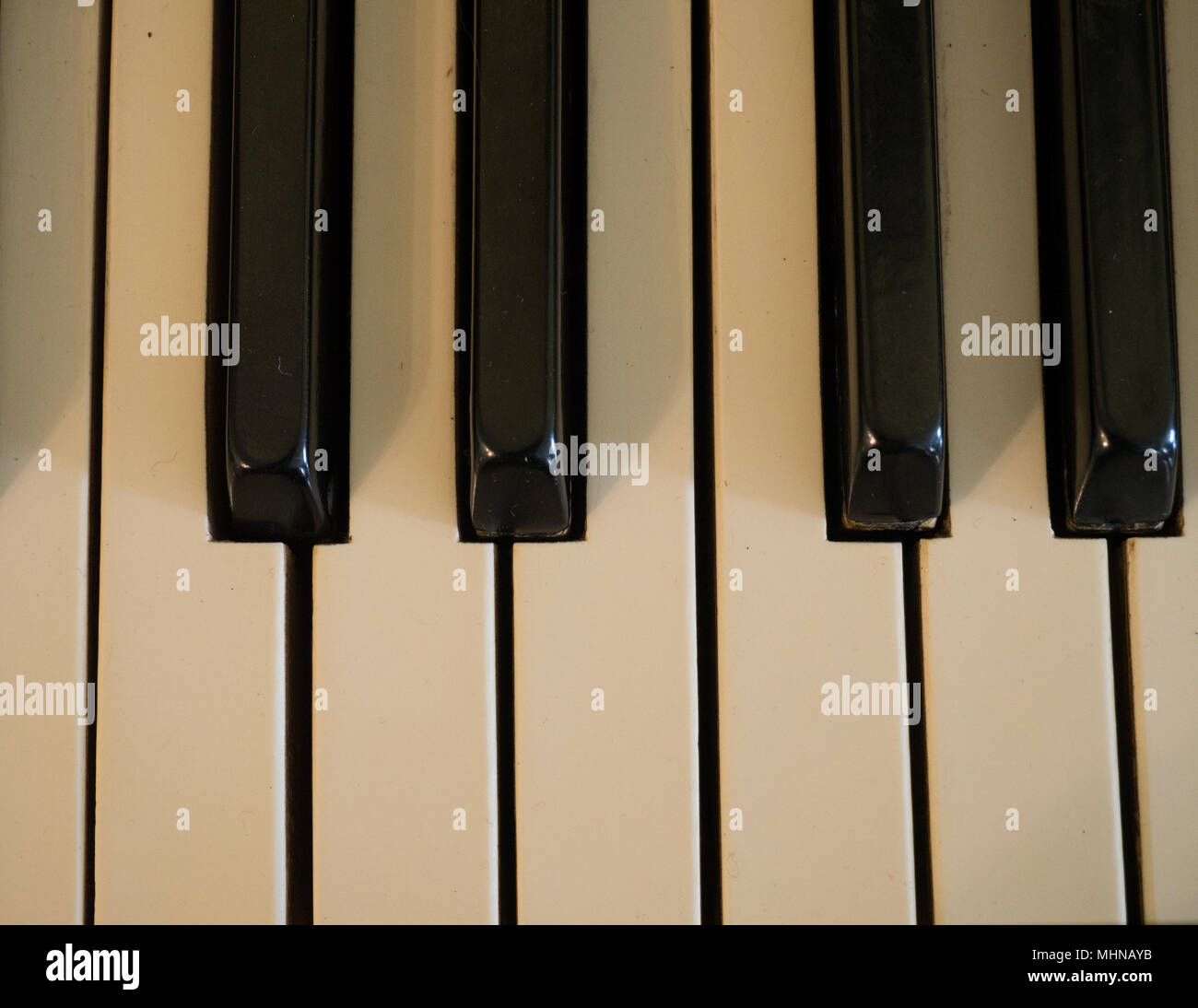 Piano keyboard, see black and white keys, the wooden old structure ...