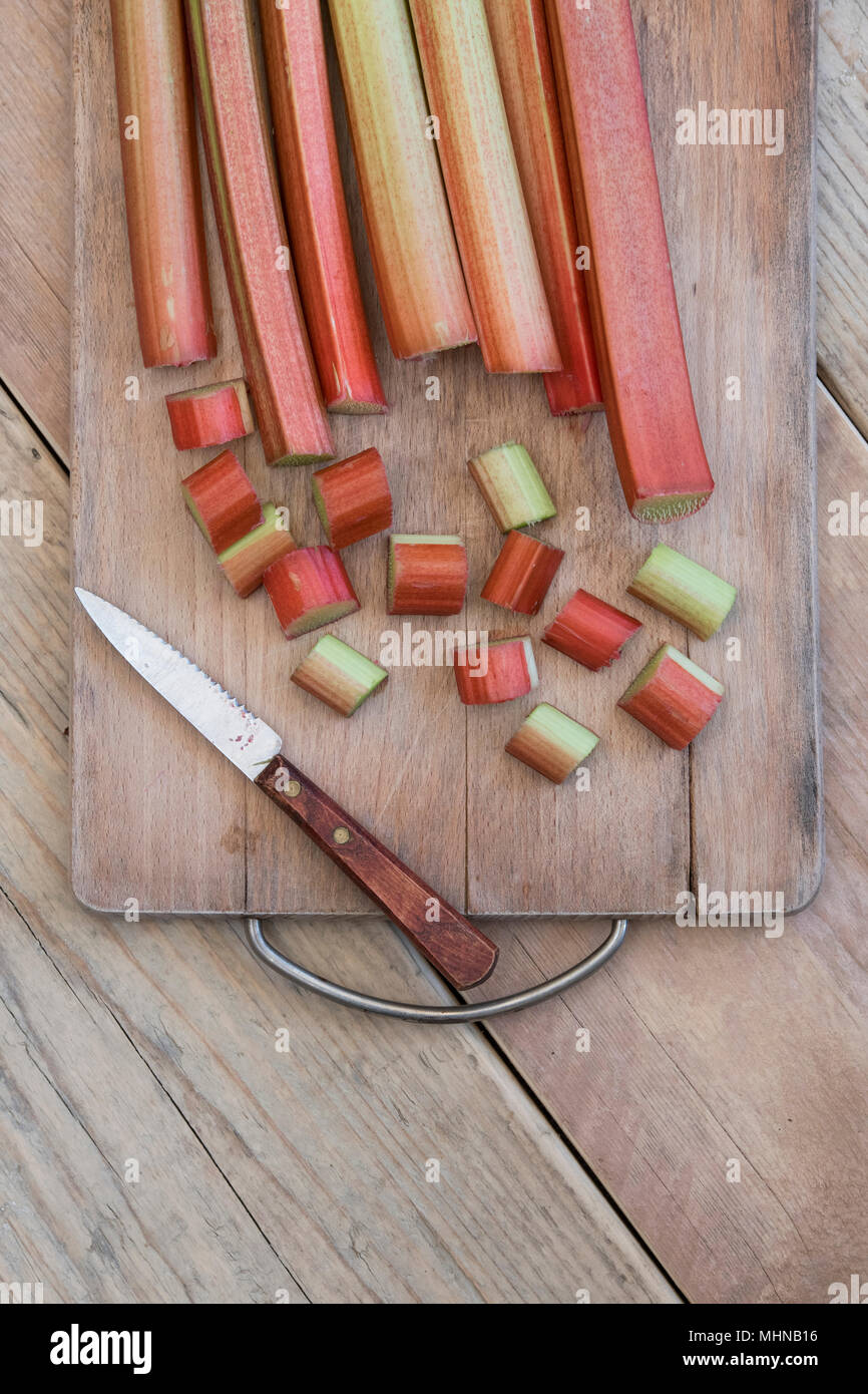 Rheum rhabarbarum. Chopped Rhubarb on a wooden board Stock Photo - Alamy
