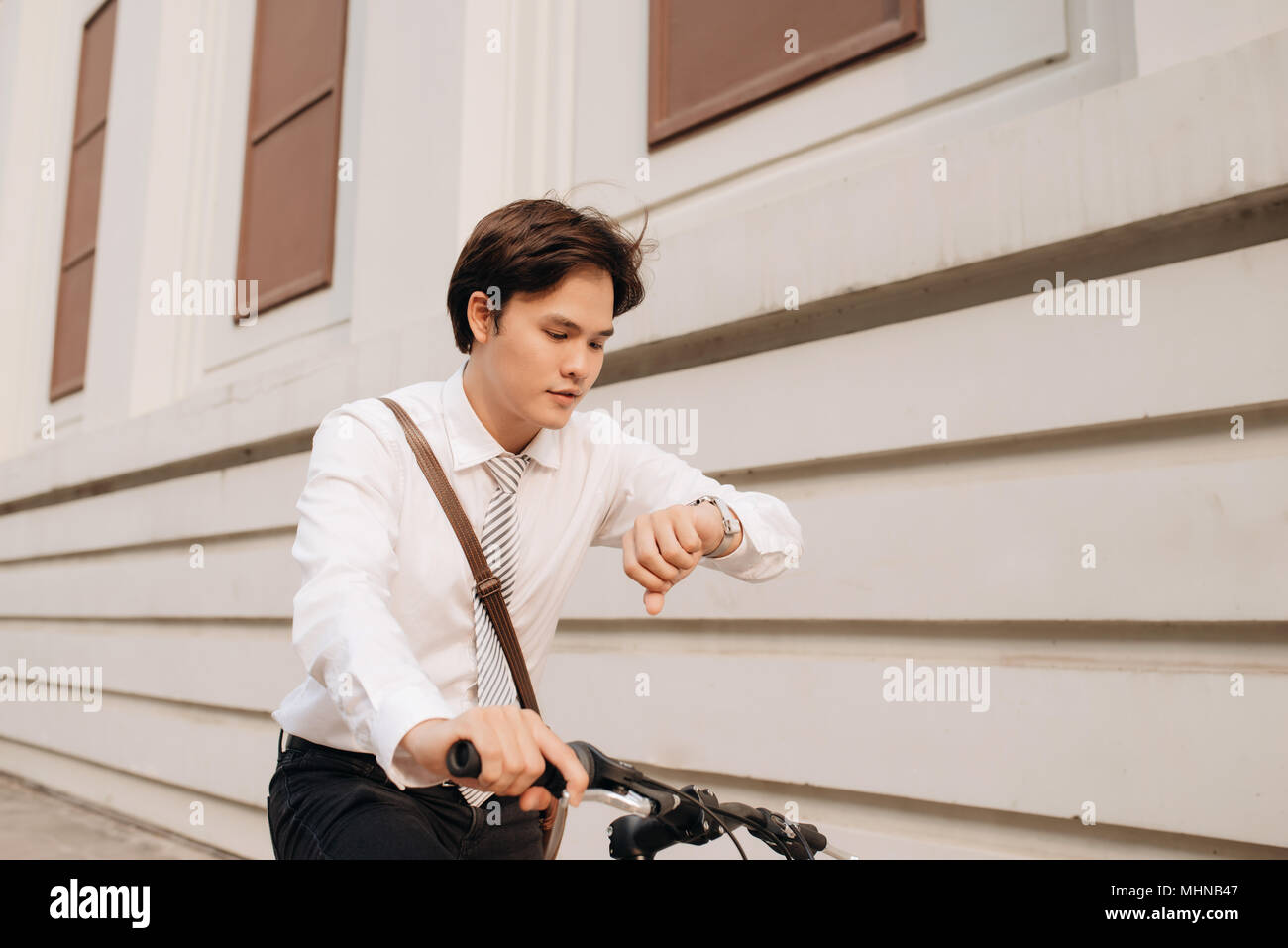 Young man waiting checking watch hi-res stock photography and images ...