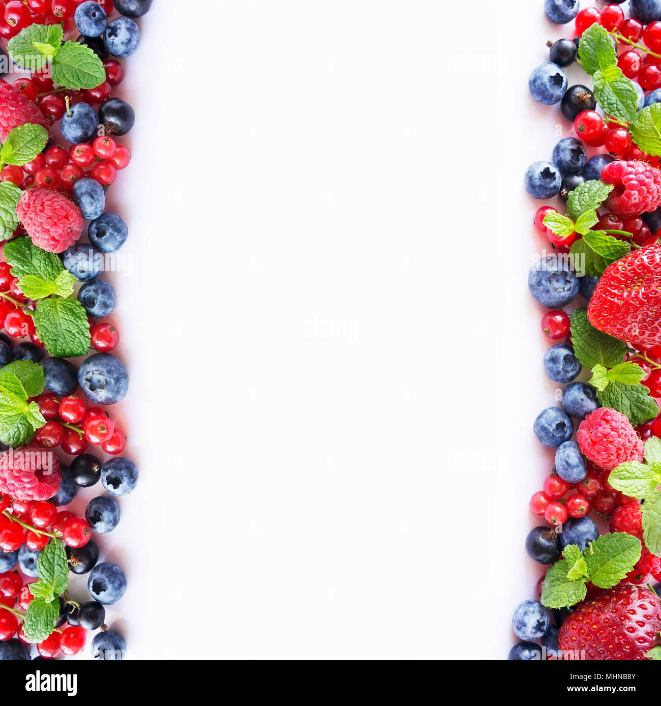 Various fresh summer berries on white background. Ripe raspberries ...