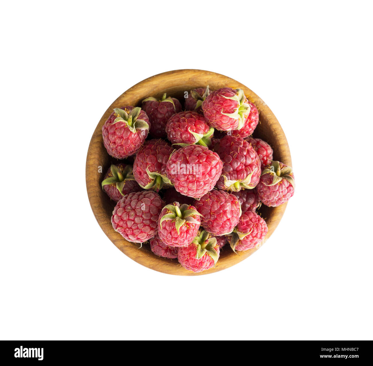 Raspberries in a wooden bowl isolated on white background. Raspberry ...