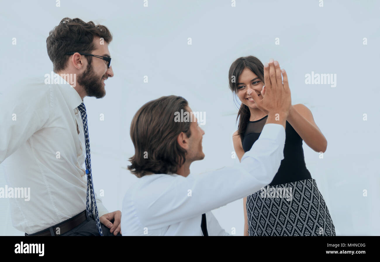 handsome man and beautiful woman giving hi five Stock Photo - Alamy