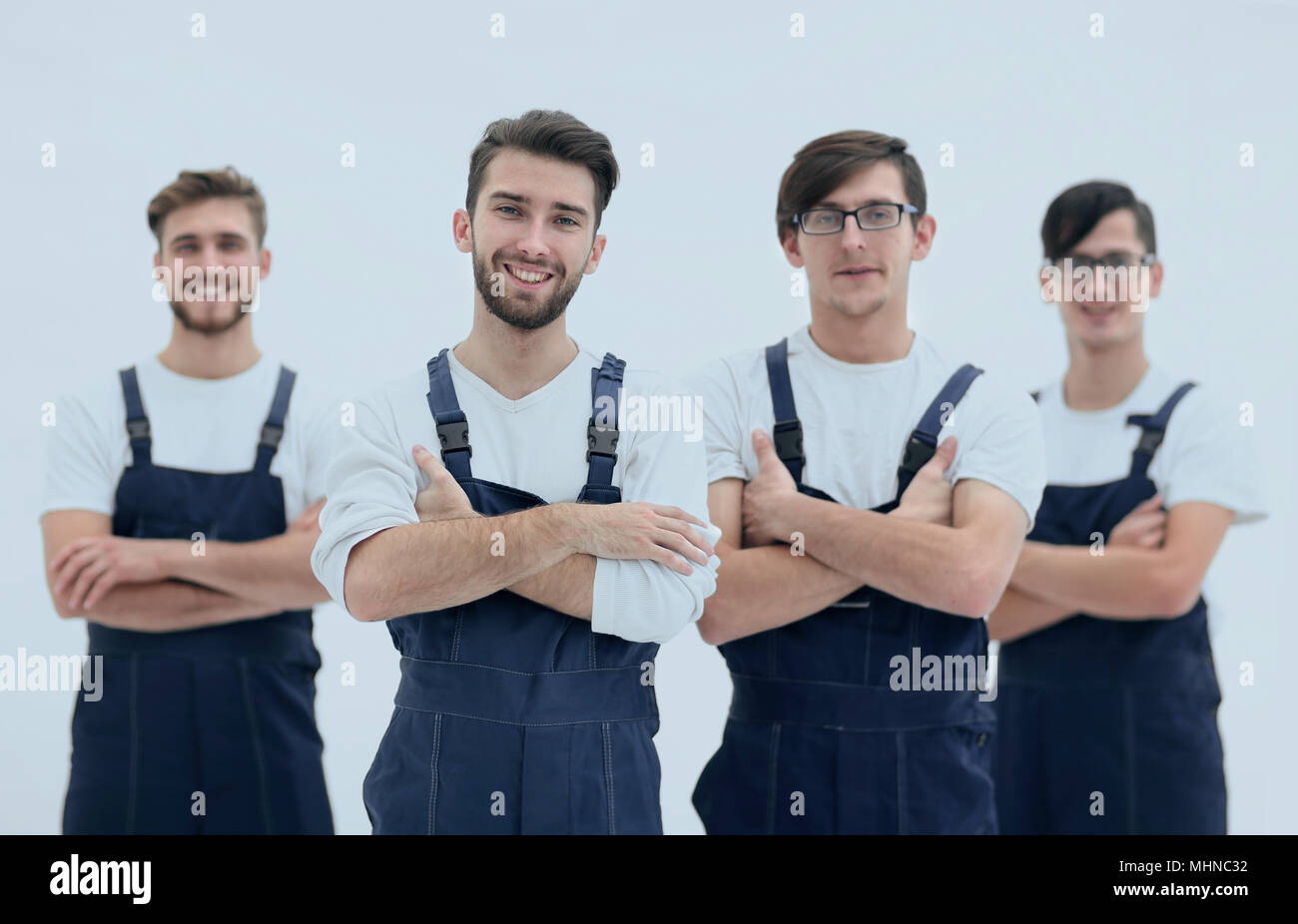 Happy team of responsible movers and their smiling leader Stock Photo ...