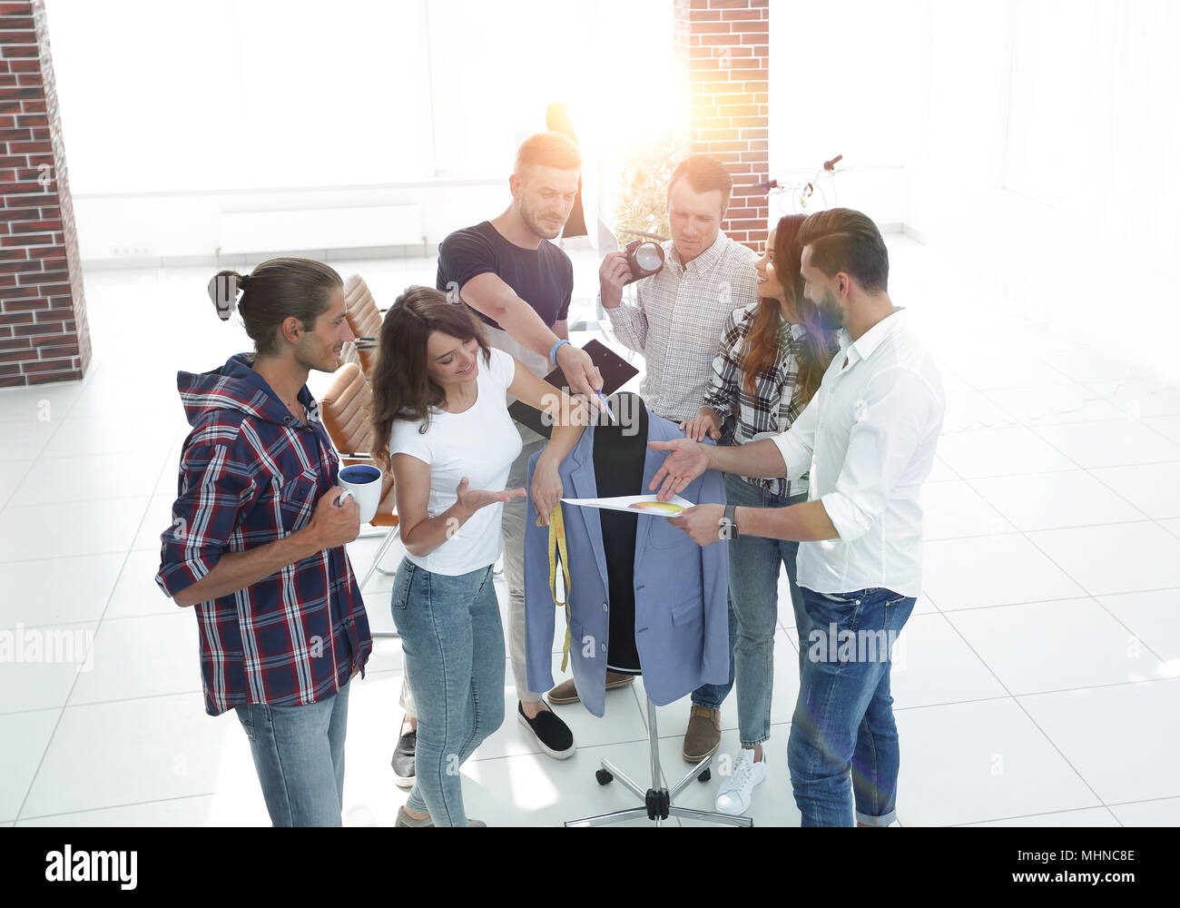 designers working with new models of men's clothing Stock Photo - Alamy