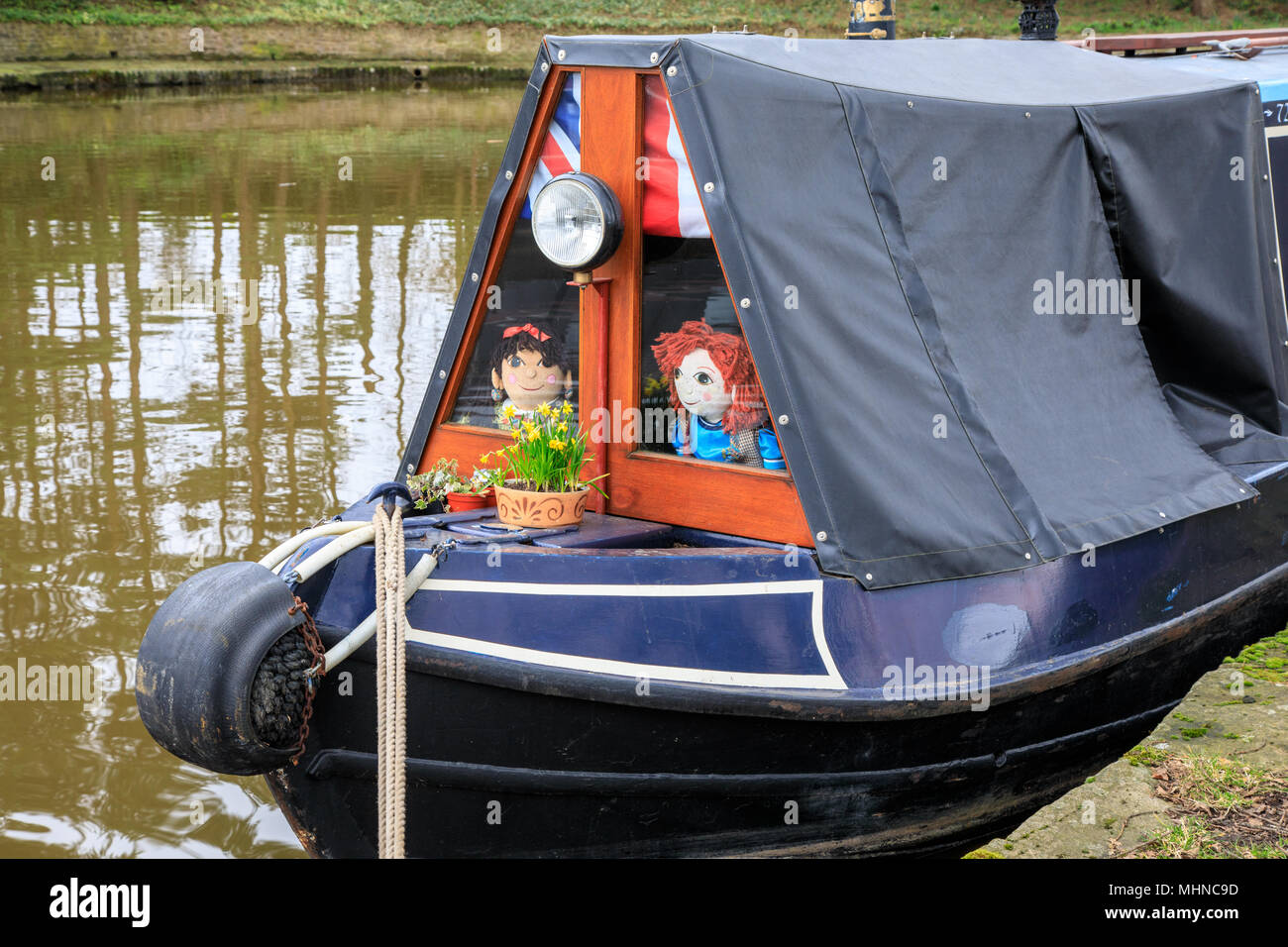 Old fashioned canal narrowboat with a canvas cover. On the Macclesfield ...
