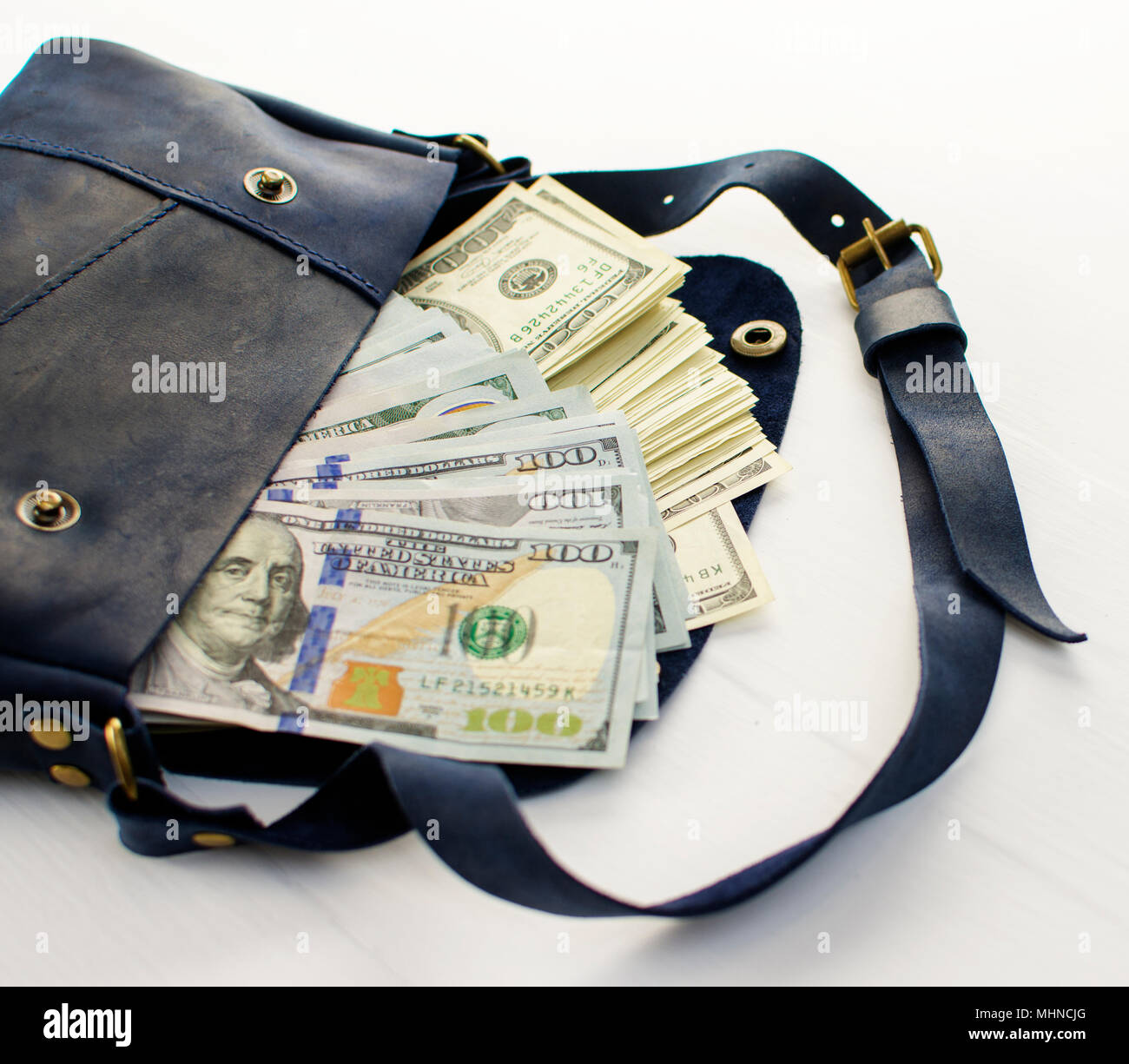 money in bag on white background Stock Photo - Alamy